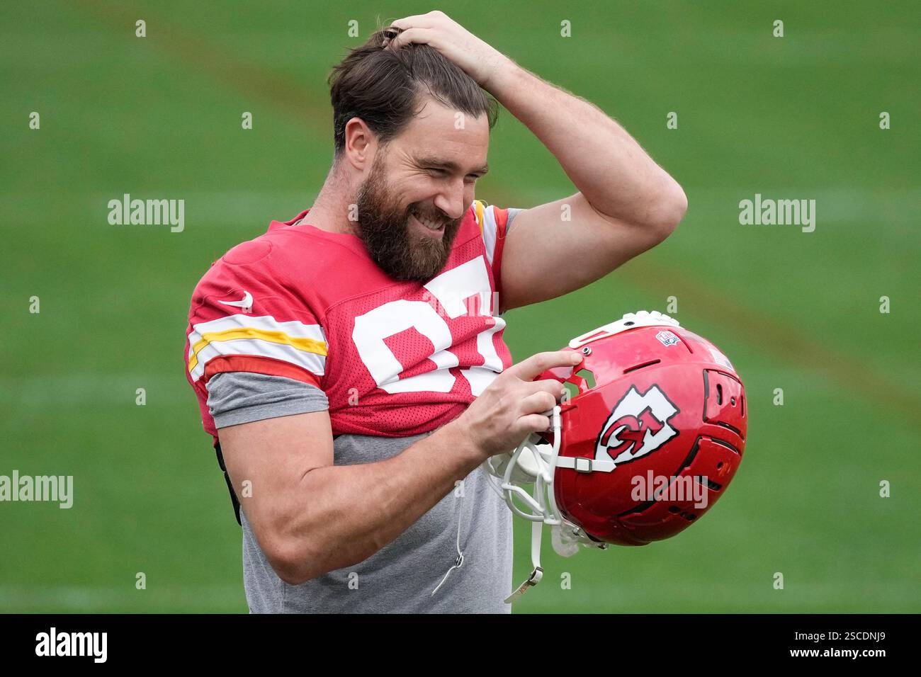 Kansas City Chiefs tight end Travis Kelce (87) puts on his helmet ...