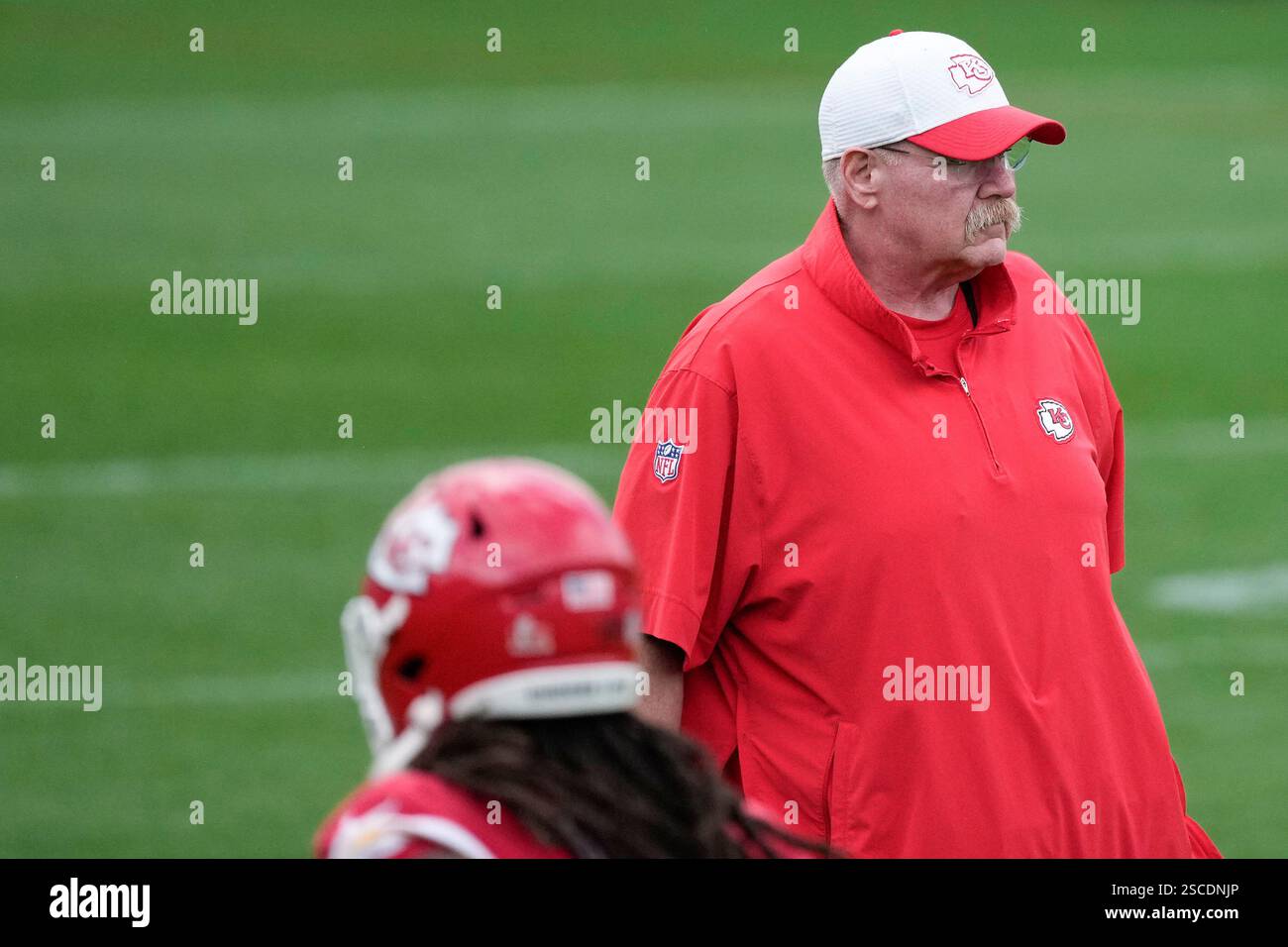 Kansas City Chiefs head coach Andy Reid watches his players stretch ...