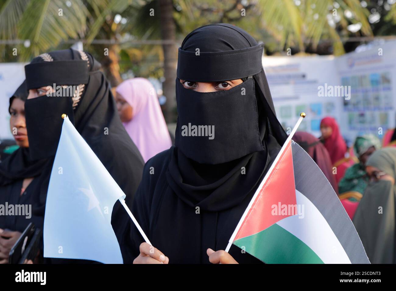 A woman waves a Palestinian flag, during a protest against U.S ...