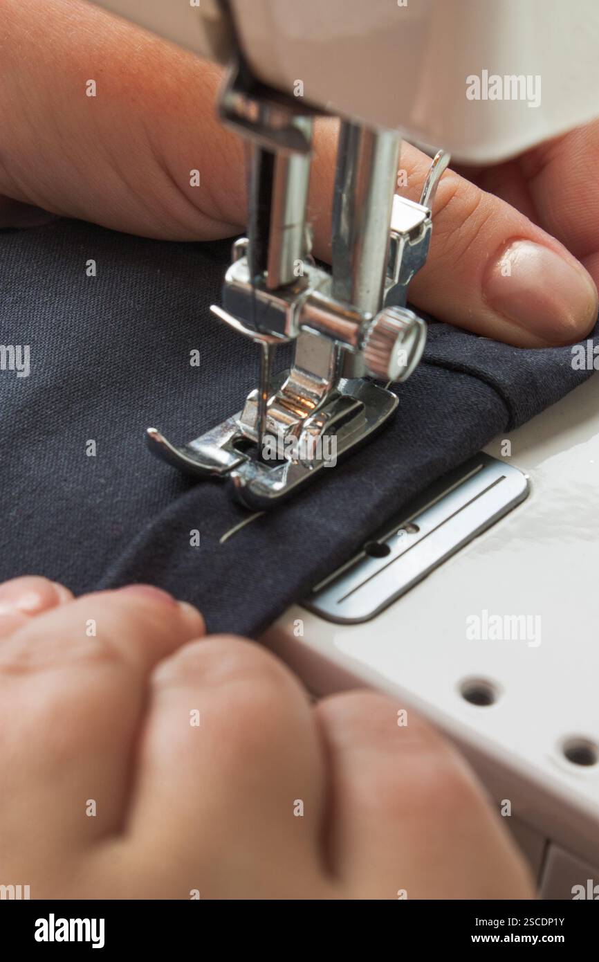 sewing machine and item of clothing Stock Photo - Alamy
