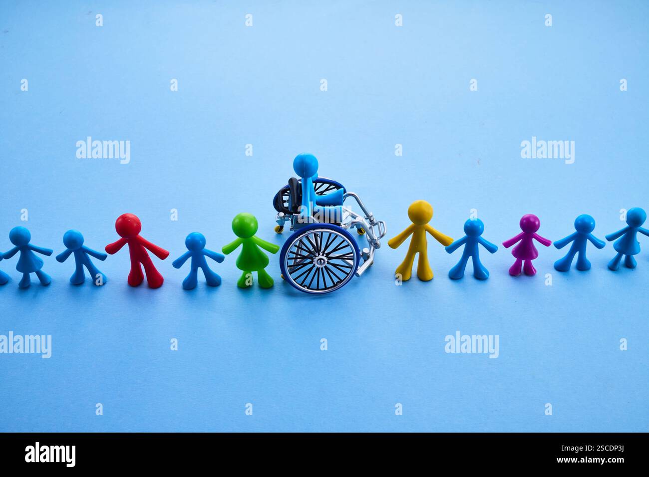 Inclusivity. Colorful figures holding hands with one in a wheelchair ...