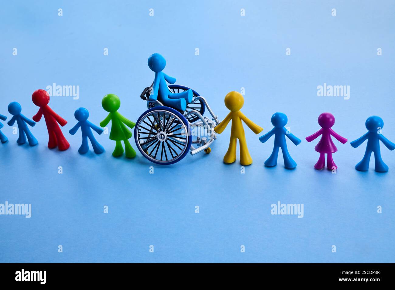 Inclusivity. Colorful figures holding hands with one in a wheelchair ...