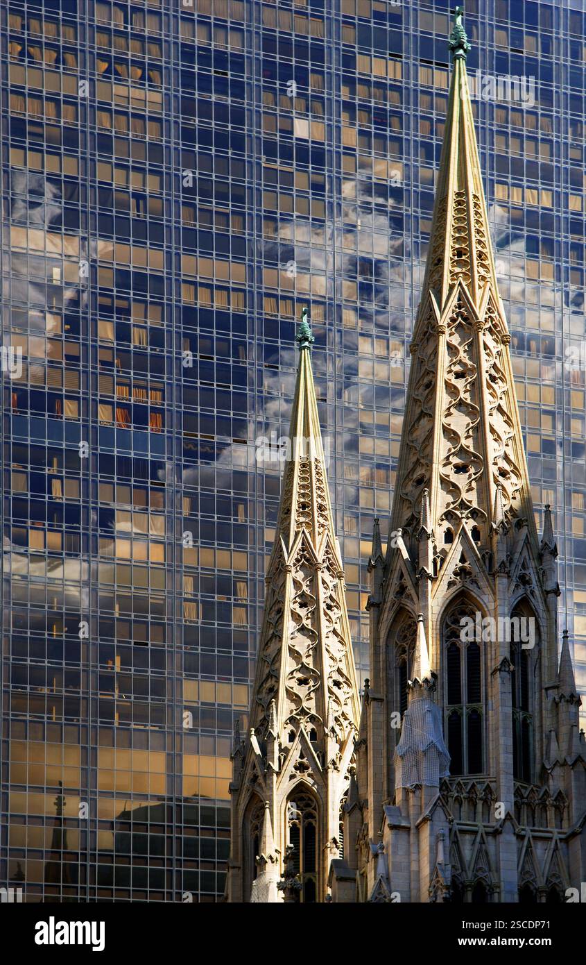 Towers of St Patrick's Cathedral in front of a skyscraper, New York ...