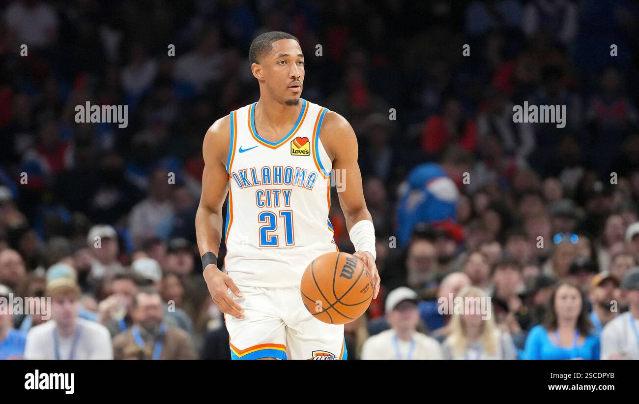 Oklahoma City Thunder guard Aaron Wiggins pushes down the court during the first half of an NBA ...