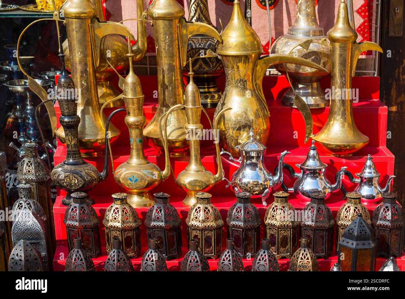 row of shiny traditional coffee pots and lamp at the souq in Dubai ...