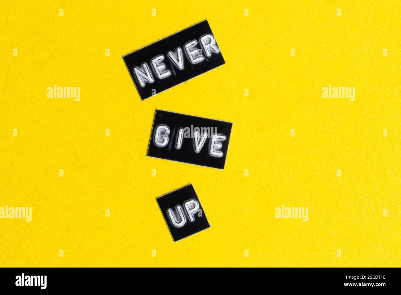 Never give up text on yellow background. Motivational concept Stock ...