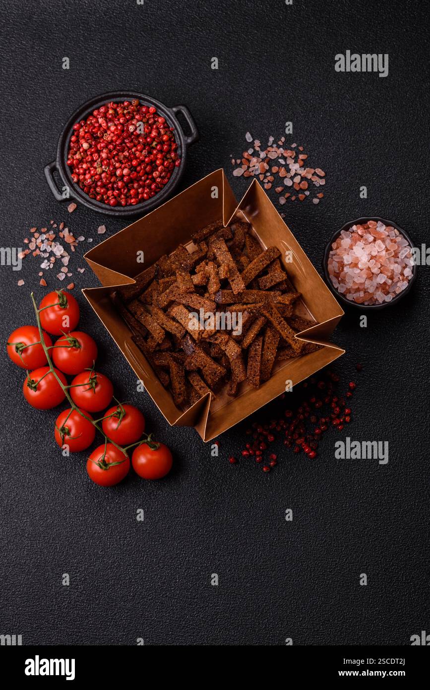 Crispy homemade brown bread crackers or croutons with seeds and grains ...