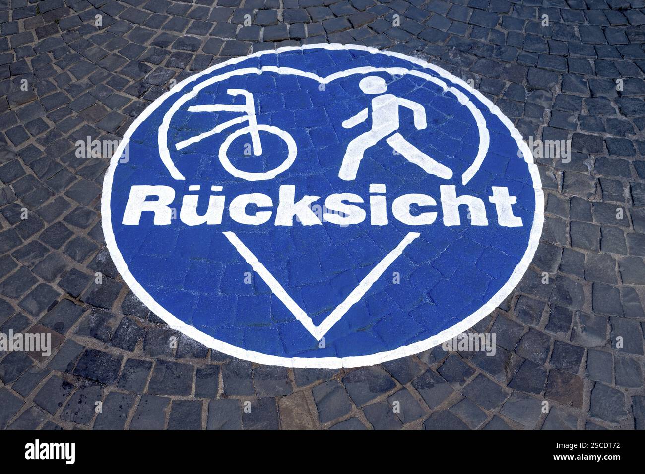 Pictogram, round symbol with heart on cobblestones, pedestrian zone ...