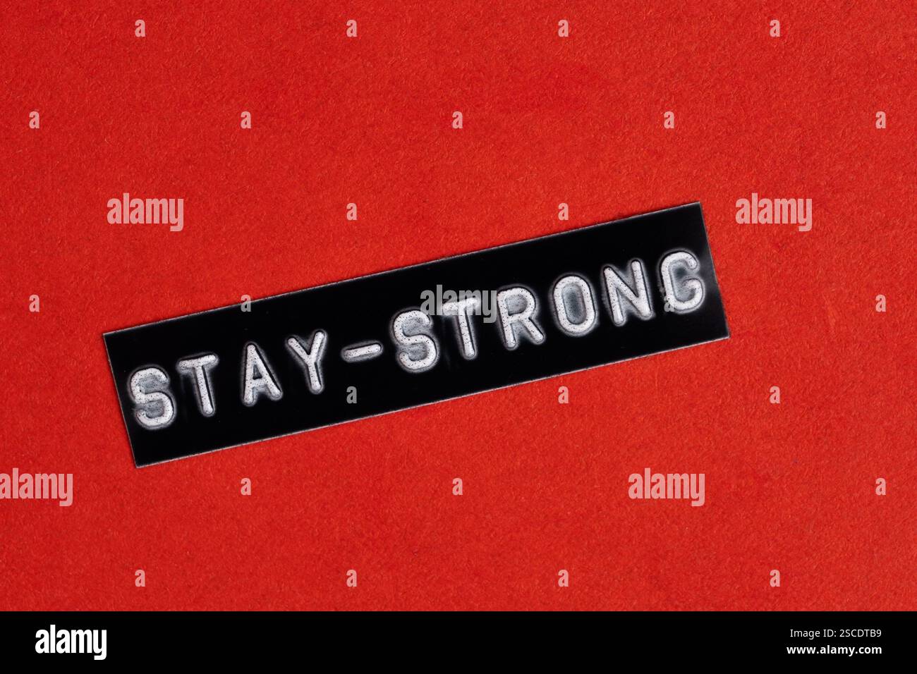 Stay Strong written in black on red background. Motivational concept ...