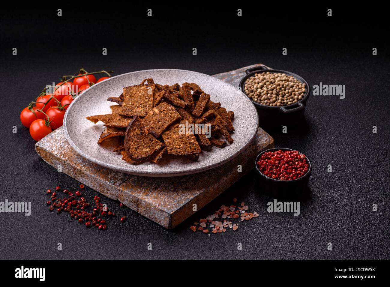 Crispy homemade brown bread crackers or croutons with seeds and grains ...