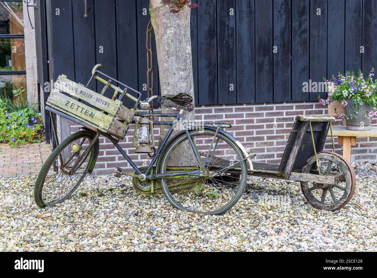 Old black baker's bike with Betuwe fruit crate in front of traditional ...