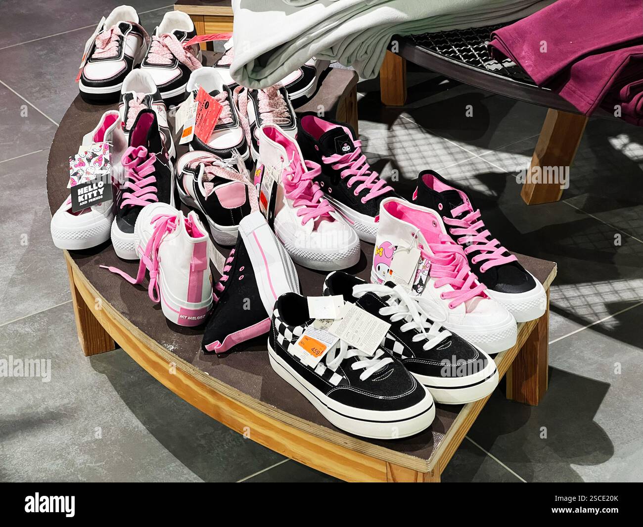 Kyiv, Ukraine - February 05, 2025: Vibrant pink and black sneakers with ...