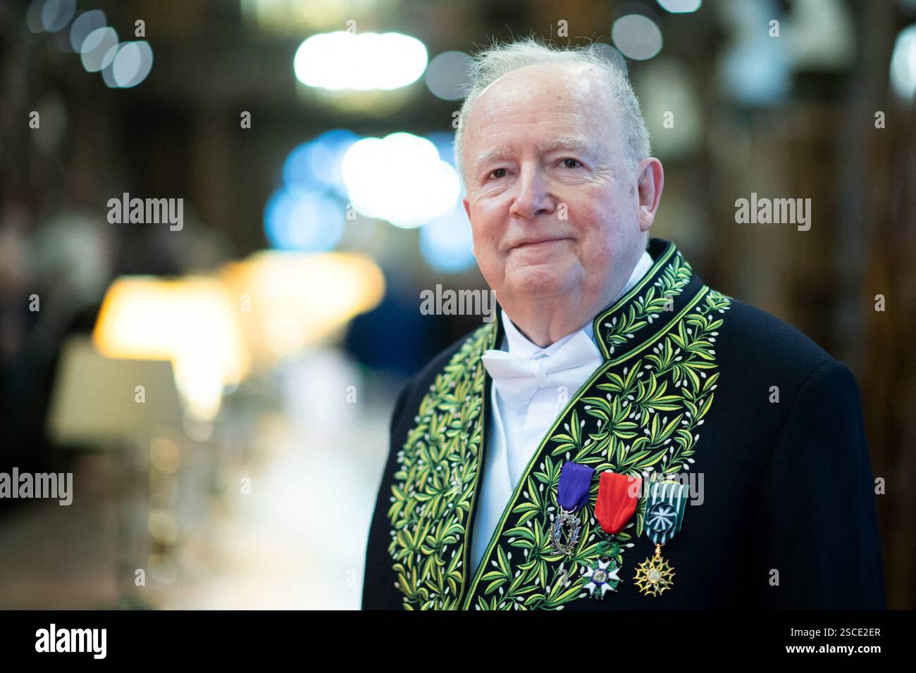 French philosopher Christian Jambet poses in the library of the ...