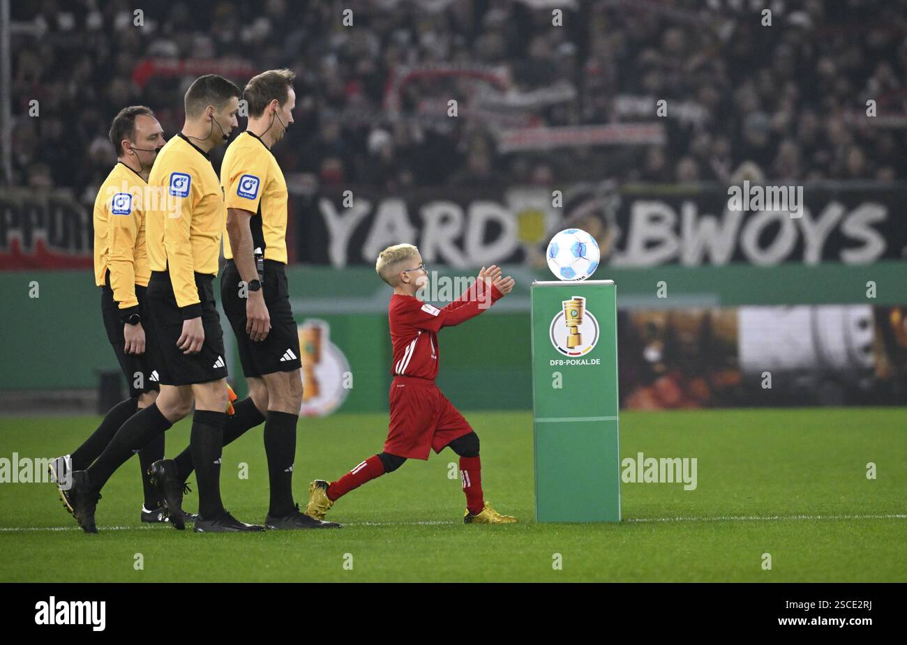 Cup match, ball boy Ballkind takes Adidas Derbystar match ball from the ...