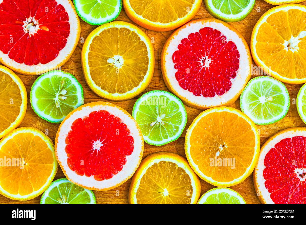 Citrus fruit background with sliced f oranges lemons lime tangerines ...