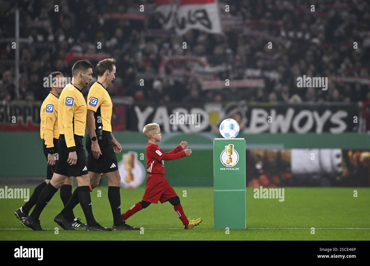 Cup match, ball boy Ballkind takes Adidas Derbystar match ball from the ...