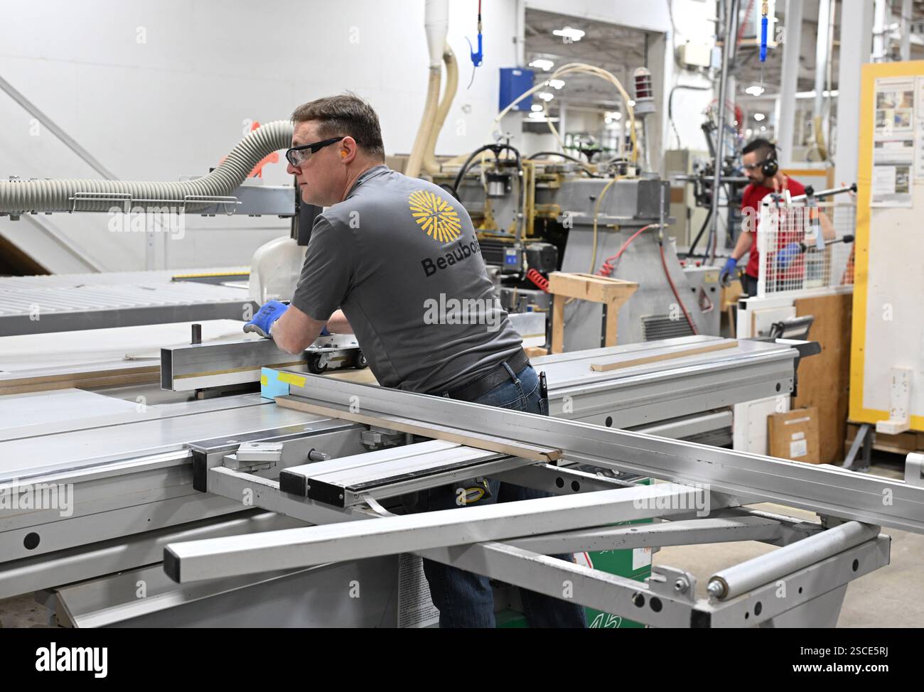 Saint Georges, Canada. 06th Feb, 2025. A man works in an architectural ...