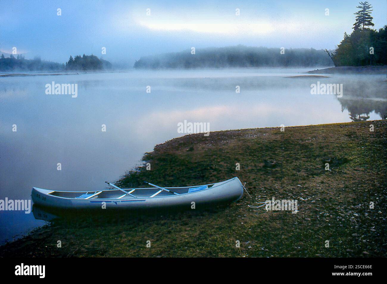 Empty canoe in mist hi-res stock photography and images - Alamy