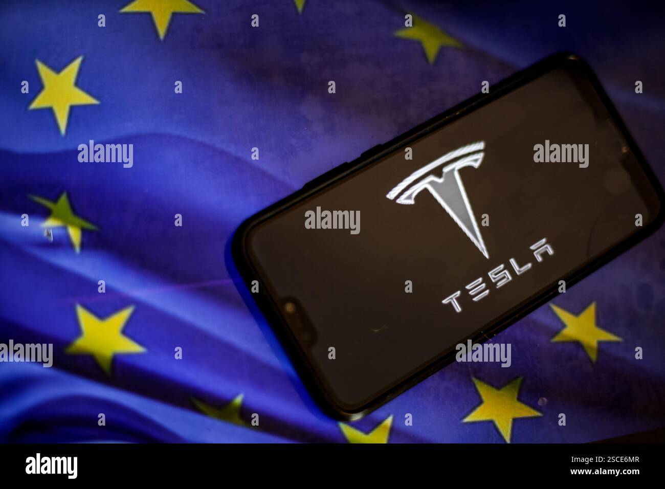 In this photo illustration the Tesla logo, US leading EV cars producer ...