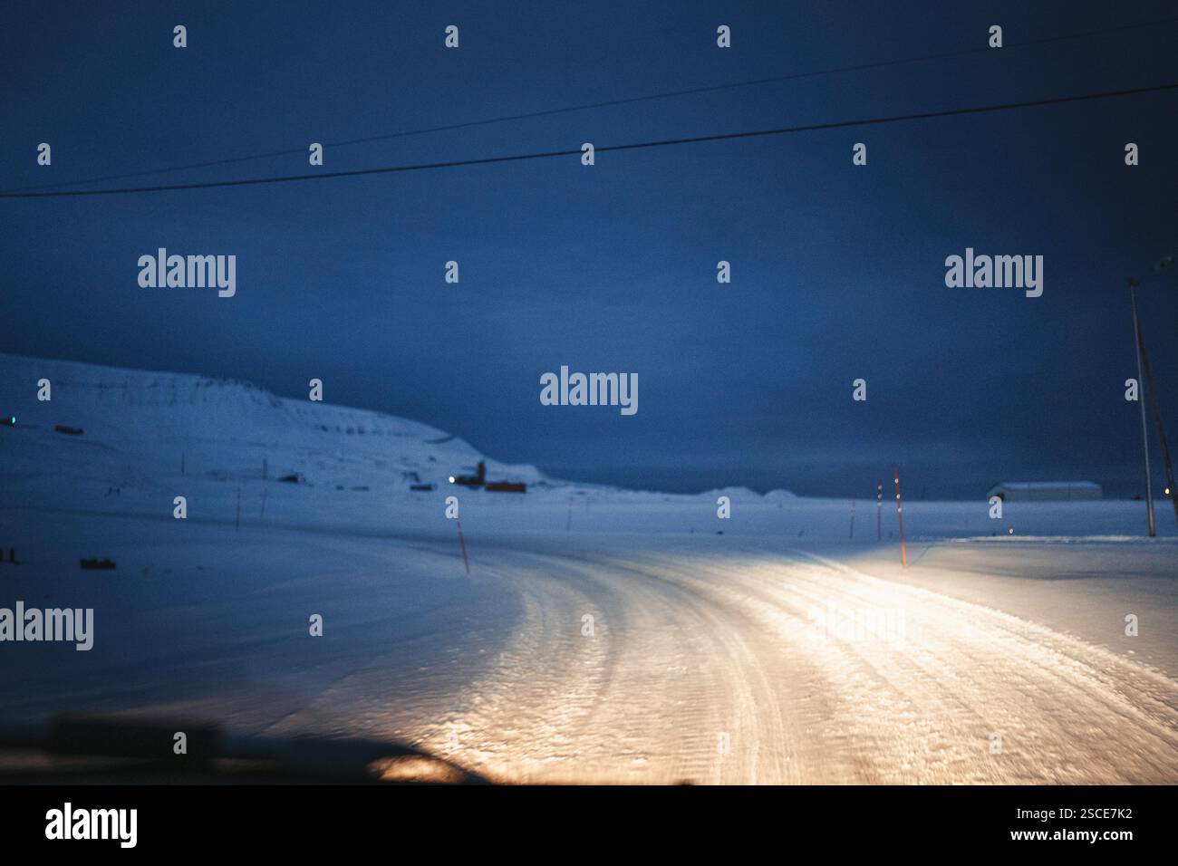 Driving along icy snowy arctic road outside Longyearbyen, Svalbard ...