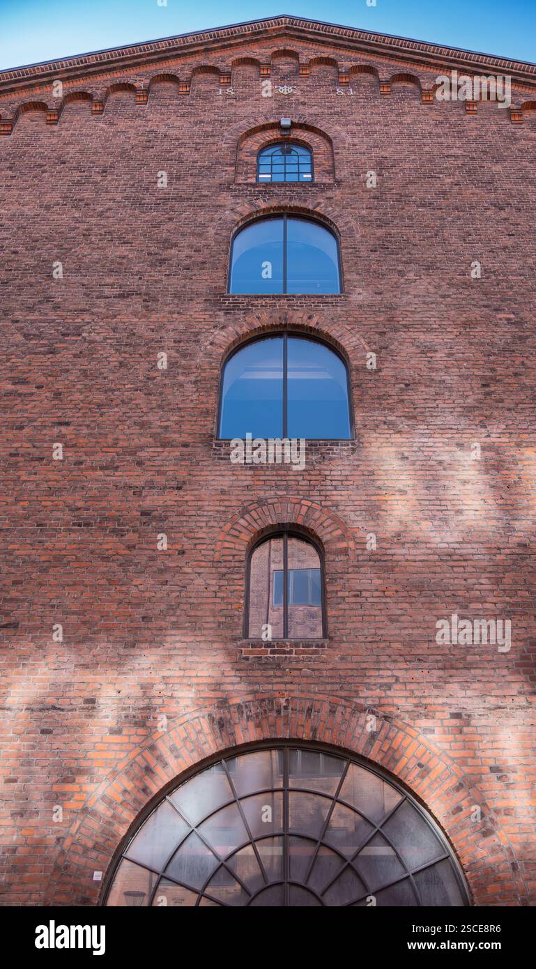 Copenhagen, Denmark - 6 June 2023: A modern brick building with four ...
