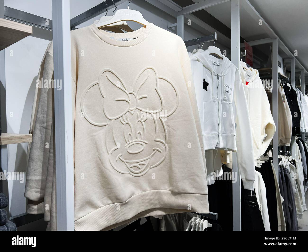 Kyiv, Ukraine - February 05, 2025: A retail store clothing display ...