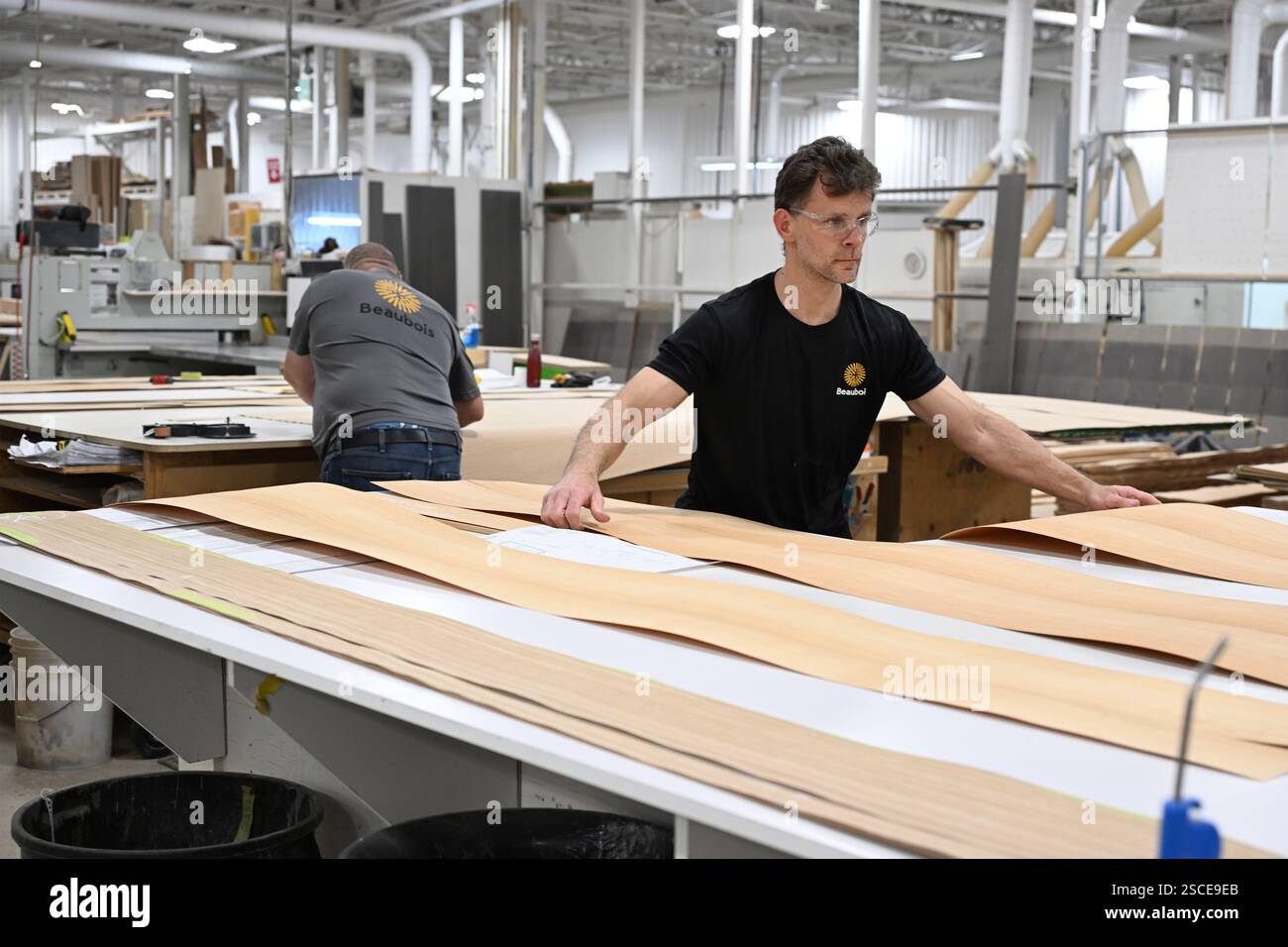 Saint Georges, Canada. 06th Feb, 2025. A man works in an architectural ...