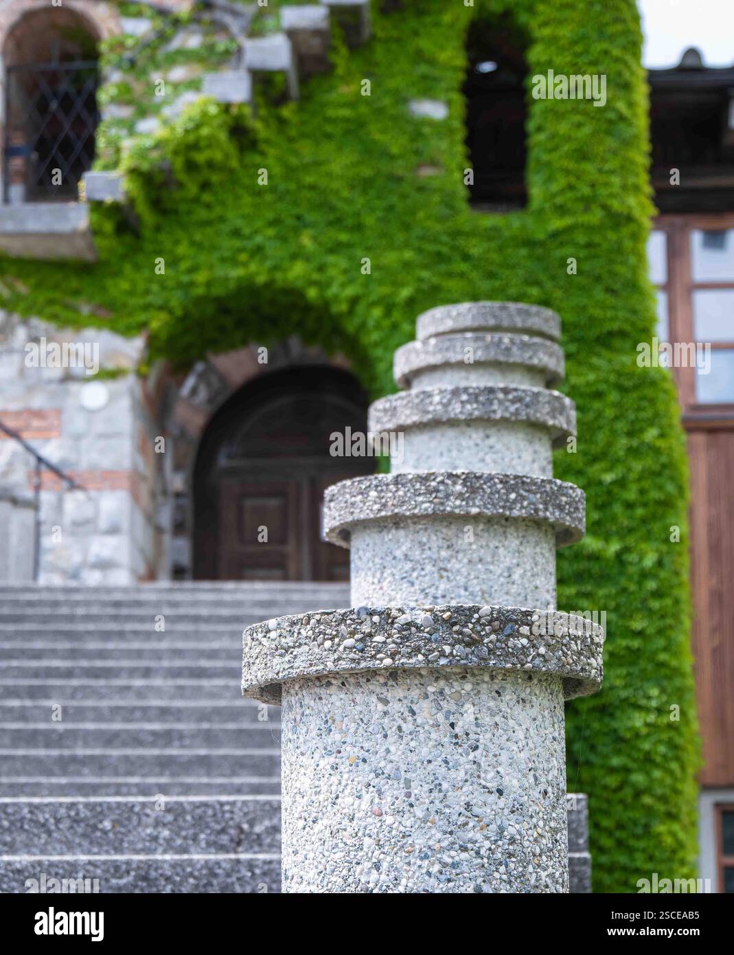 A sturdy concrete column stands at the foot of the church tower ...
