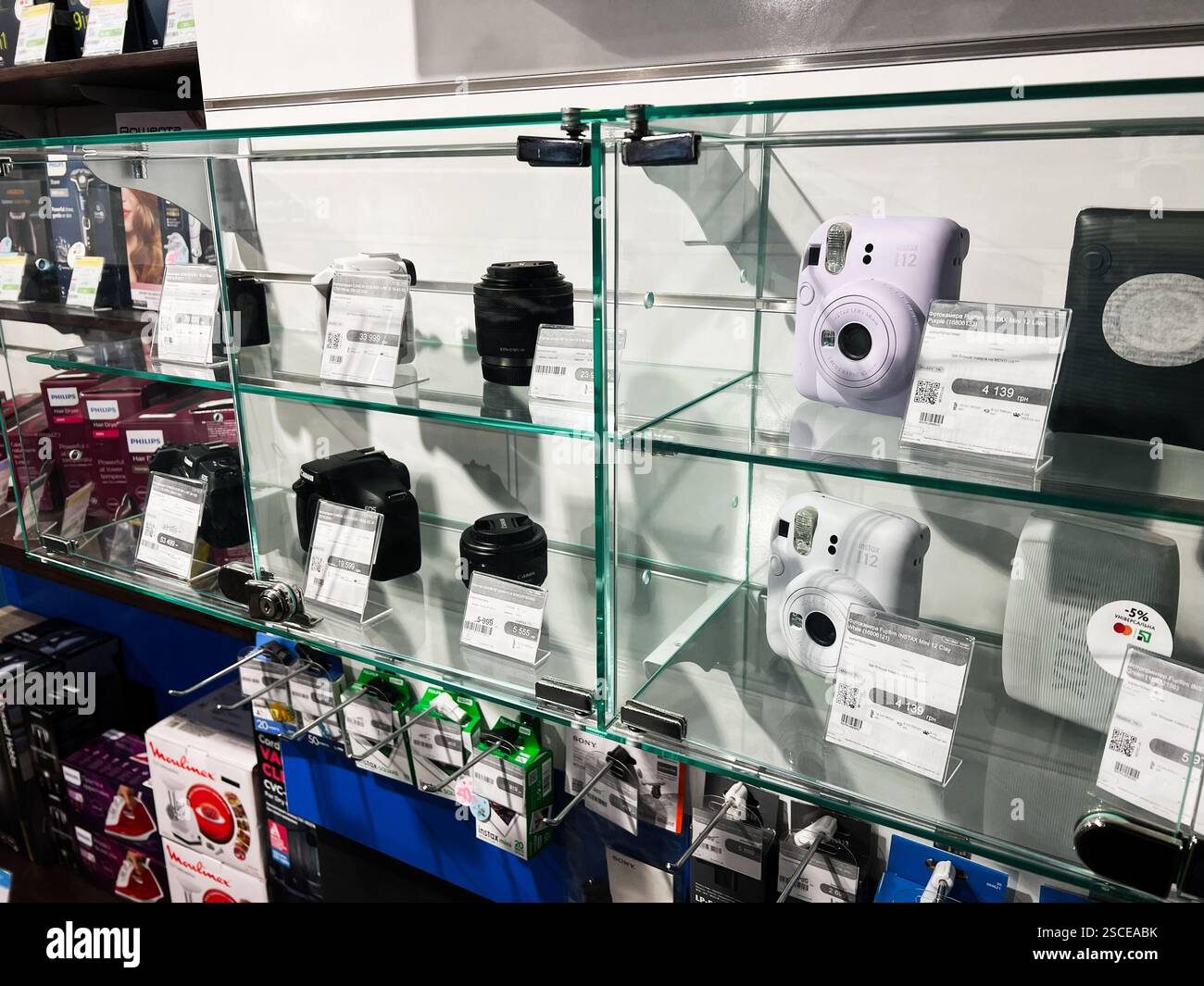 Kyiv, Ukraine - February 05, 2025: Showcase of cameras and lenses ...