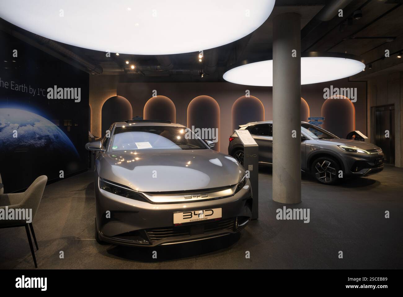 View through shop window to showroom, sales exhibition of the car brand ...