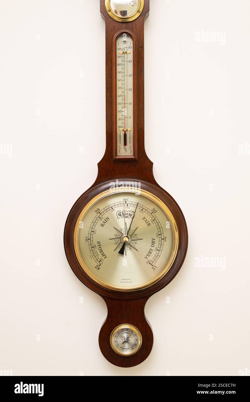 Close up of an aneroid barometer mounted on a wall Stock Photo - Alamy