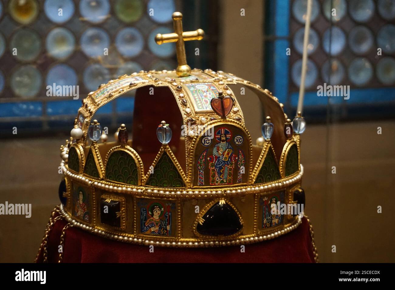 Crown jewels and a golden cross grace the historic royal crown of the ...