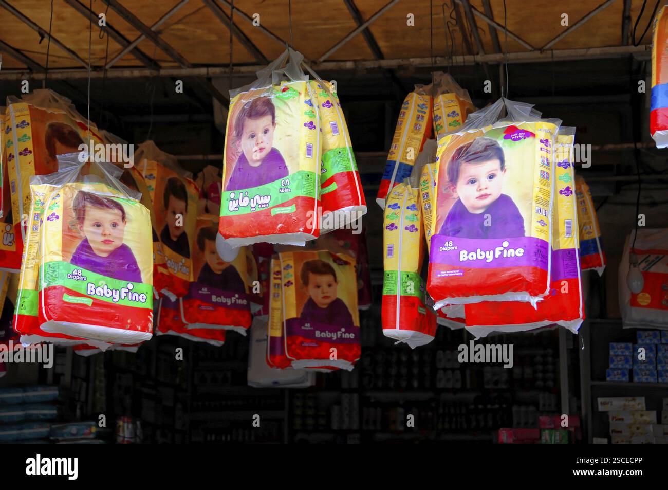 Meknes, Morocco, Africa, Baby food packaging hanging on a display in a ...