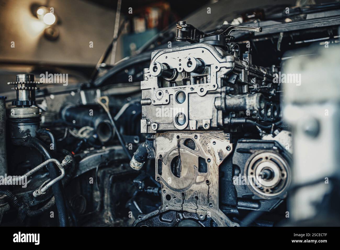 Close-up view of a car engine being repaired in a workshop Stock Photo ...