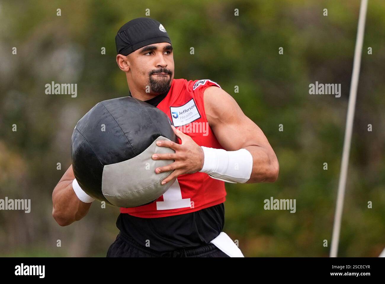 Philadelphia Eagles quarterback Jalen Hurts (1) warms up during an NFL ...