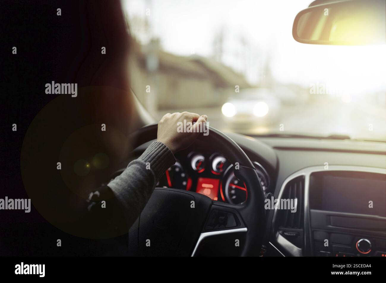 View from a car's interior, focusing on the dashboard and road ahead in ...