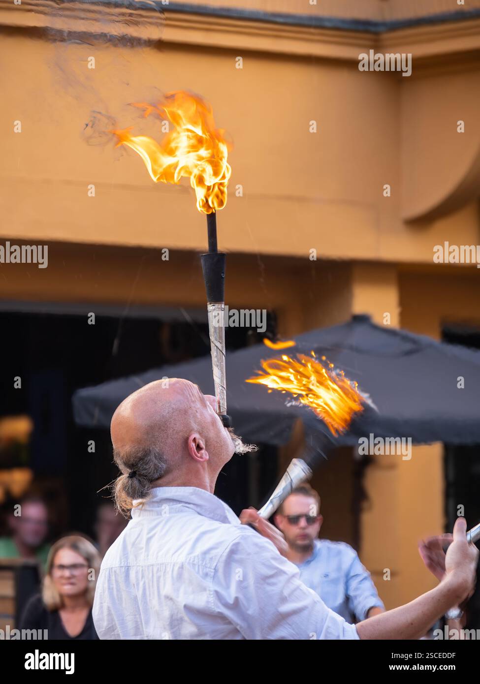 Performer juggling fire torches outdoors hi-res stock photography and ...