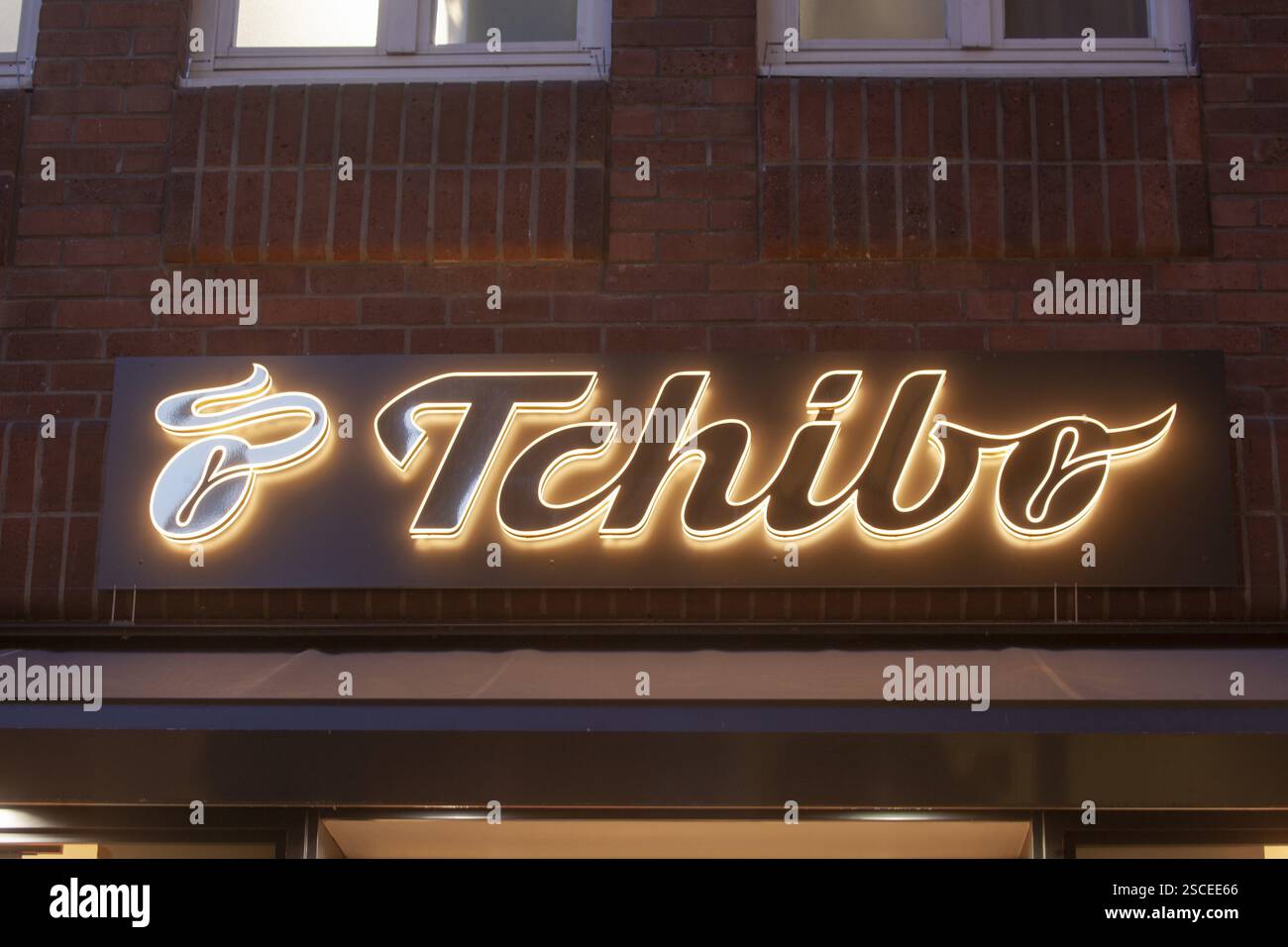 Tschibo lettering and logo on a Tschibo shop at dusk, Bremen, Germany ...