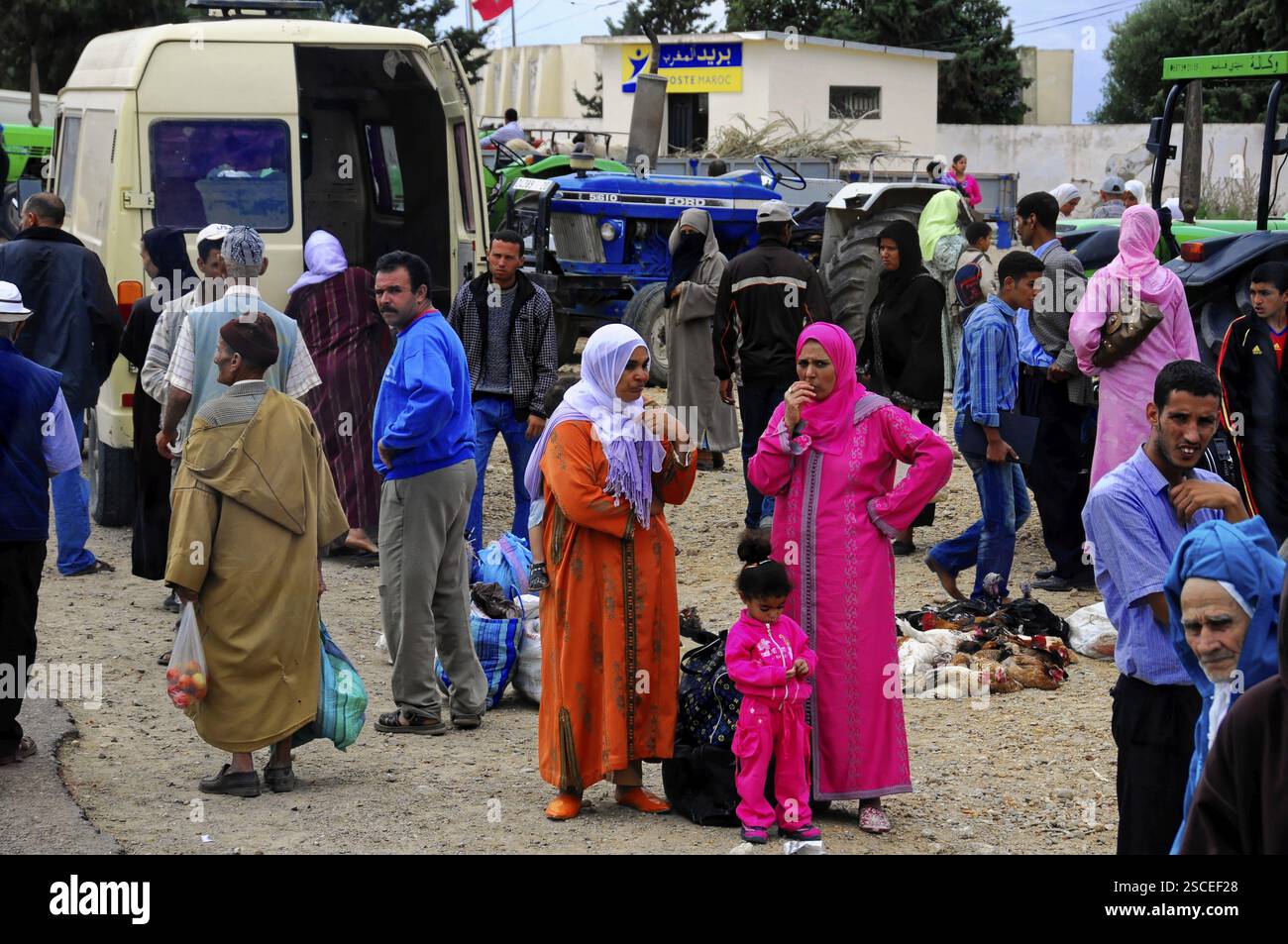 On the way to Fes, Morocco, People in traditional clothing at a lively ...
