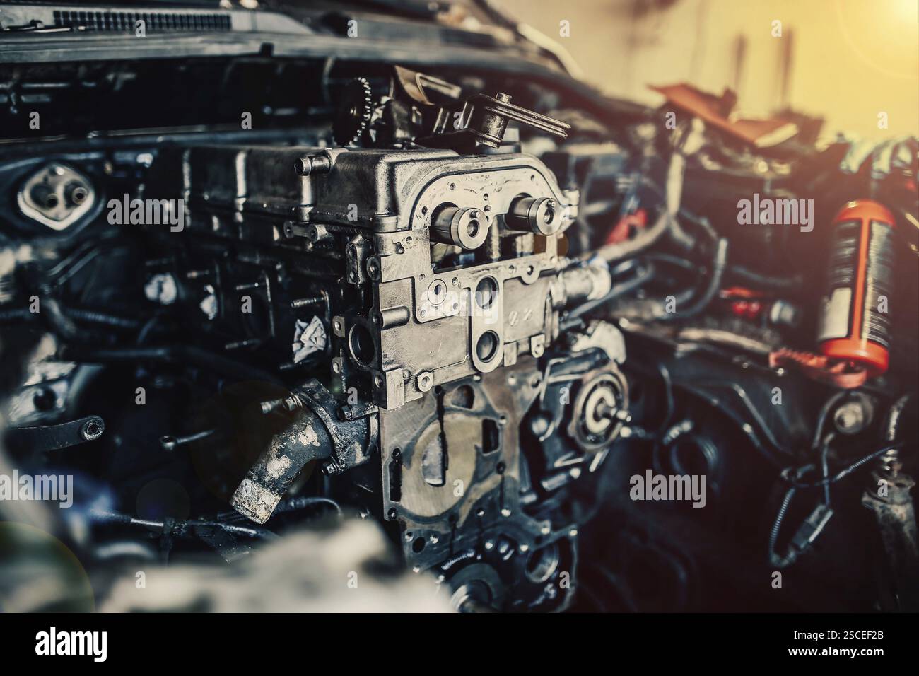 A view of a complex car engine with metallic components in a garage ...