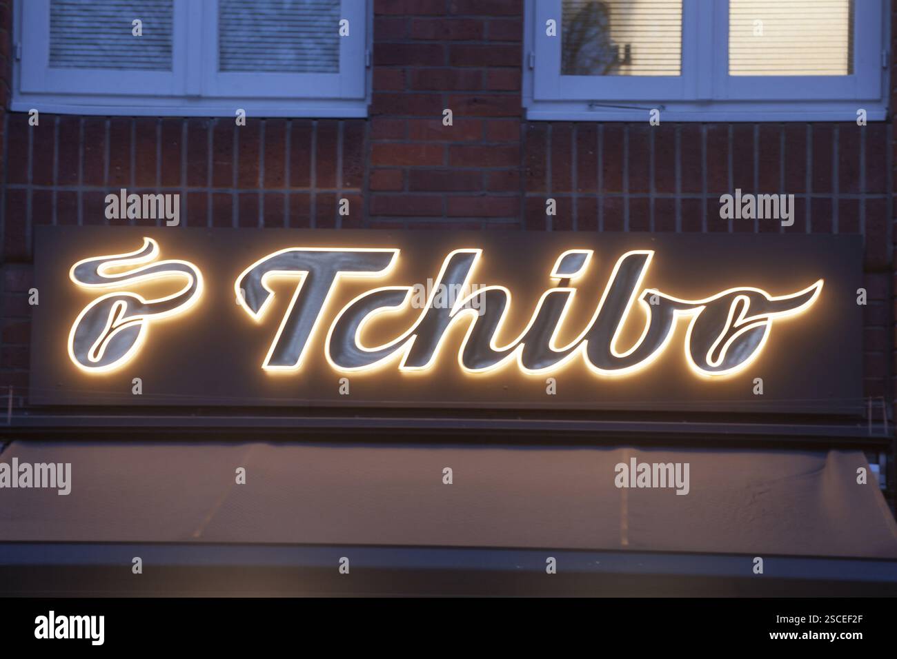 Tschibo lettering and logo on a Tschibo shop at dusk, Bremen, Germany ...