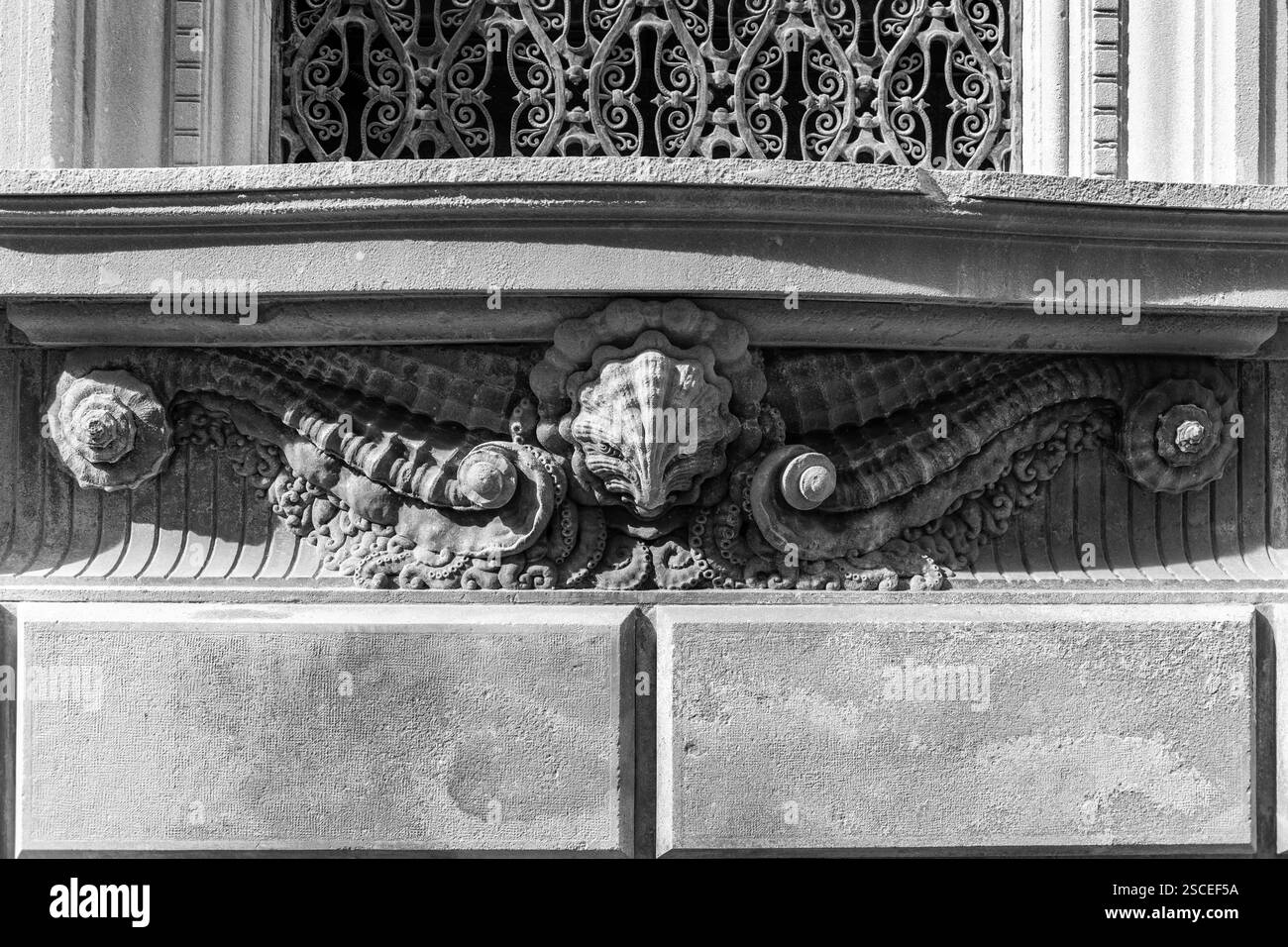Detail from an ornate European style window of a historical building ...
