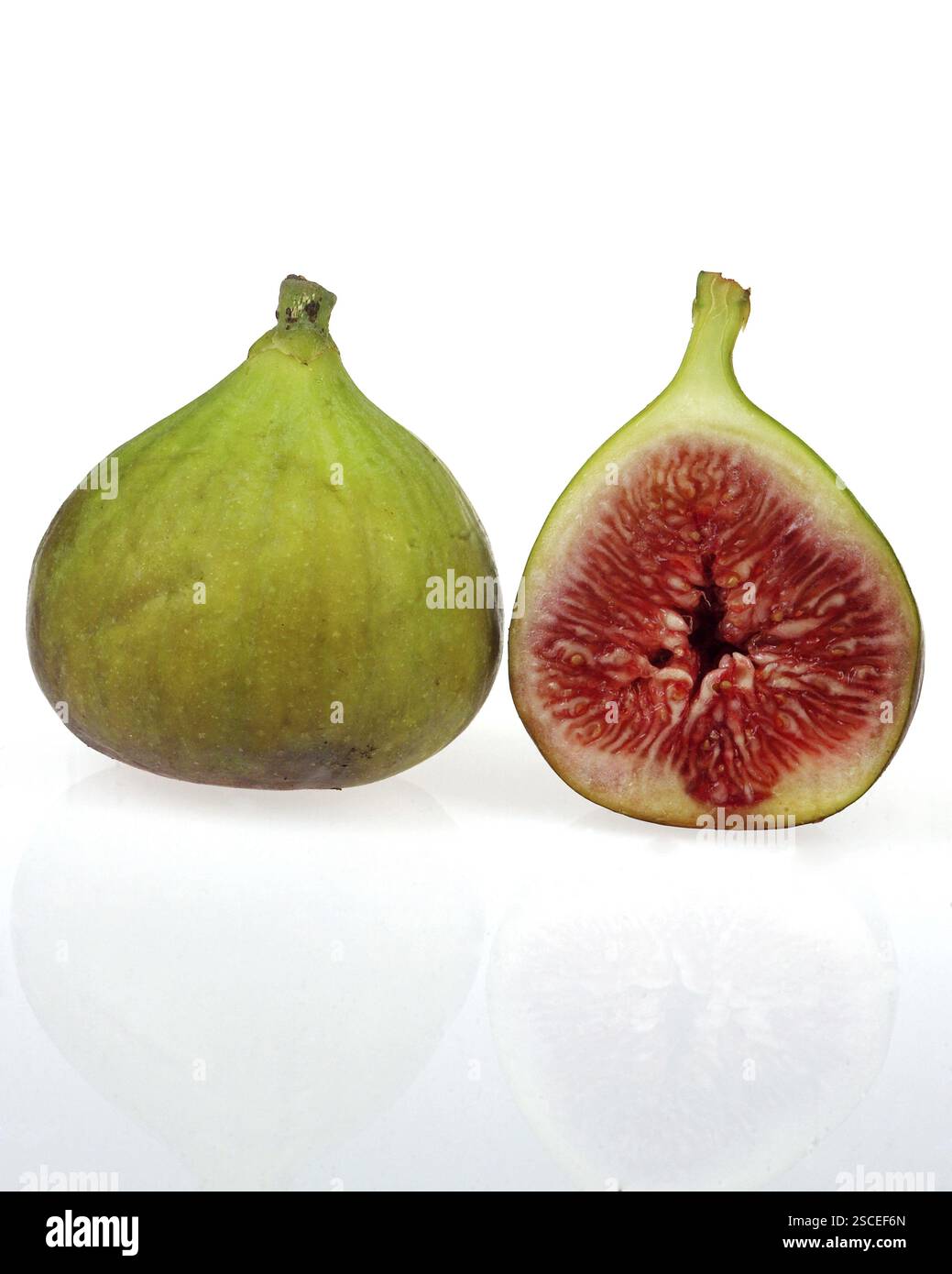 Fruit, Fig, Anjir one full and one cut on white background Stock Photo ...