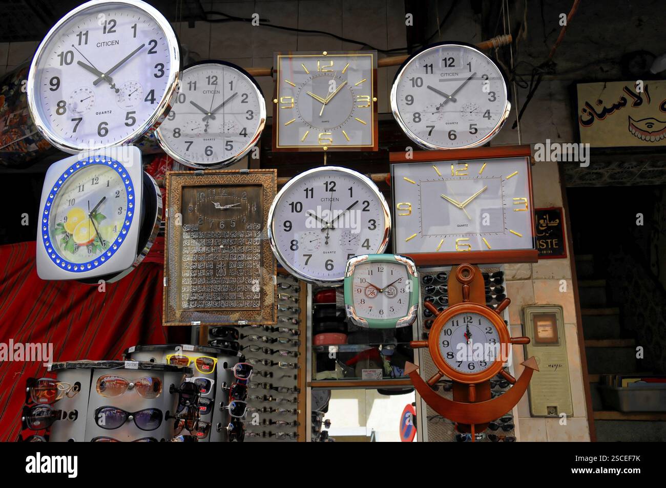 Meknes, Morocco, Africa, Various wall clocks on display at a stall in a ...