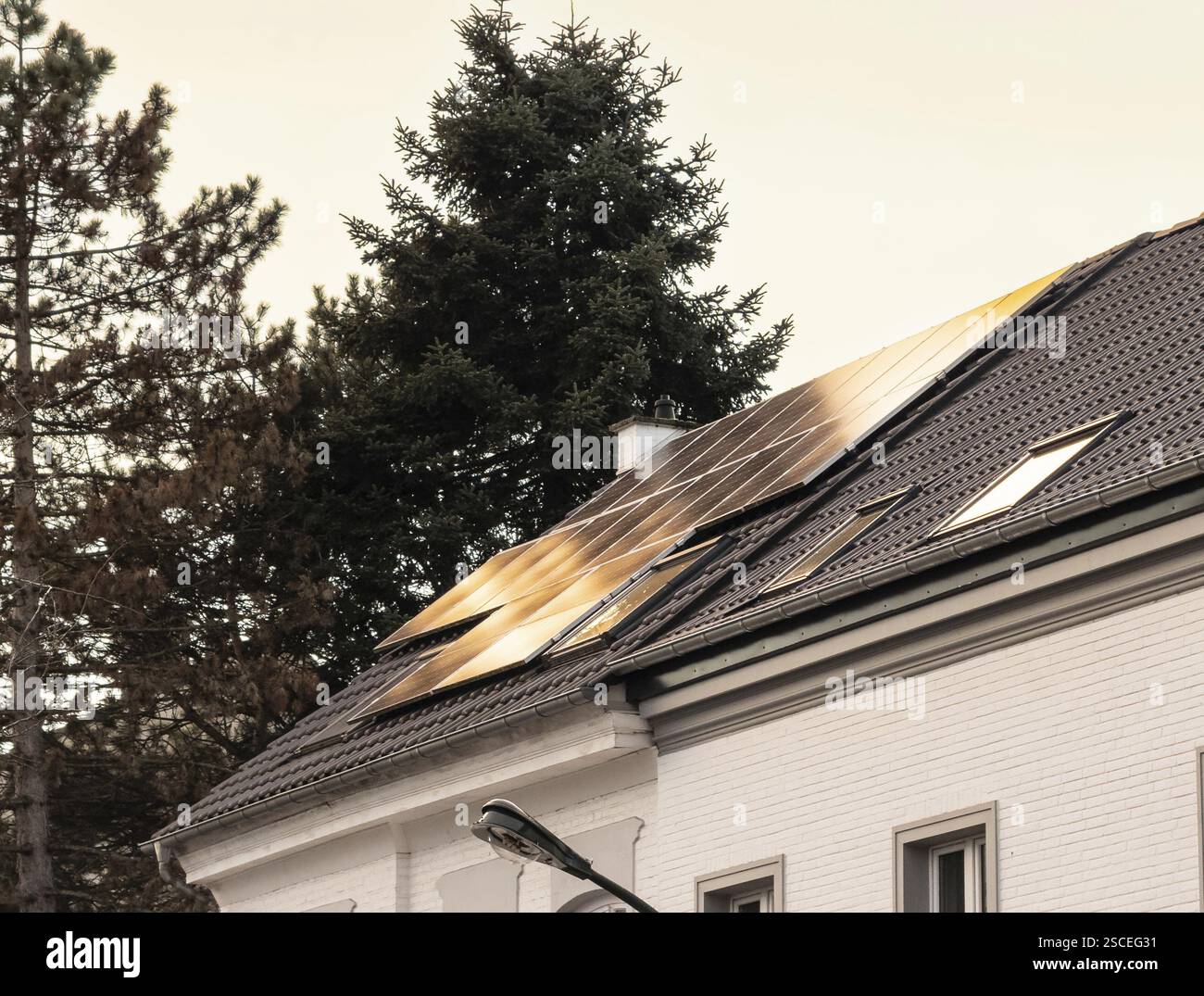 Solar panels at sunset on the roof of a detached house in Duesseldorf ...