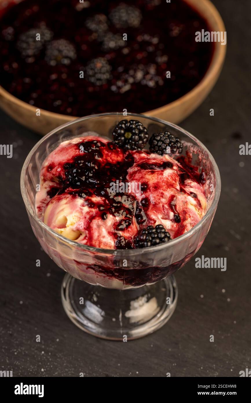 raspberry ice cream in a glass container, cold natural ice cream close ...