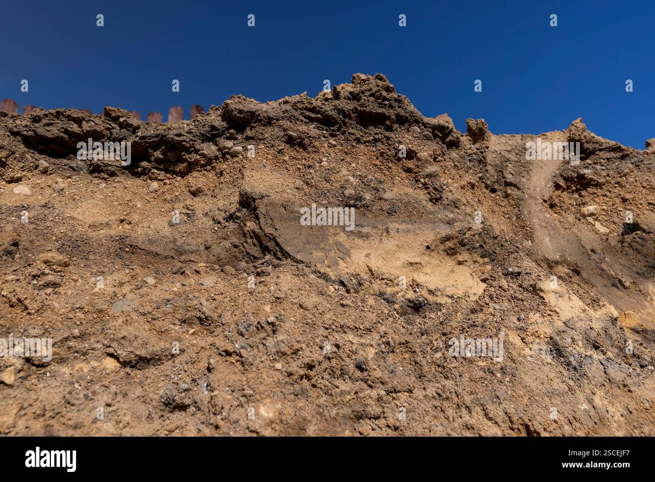 construction work during the excavation of a pit for laying different ...