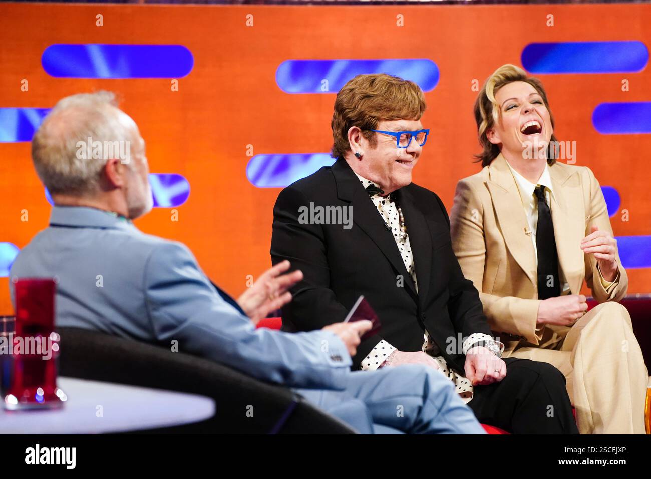 EDITORIAL USE ONLY Graham Norton, Elton John and Brandi Carlile during ...