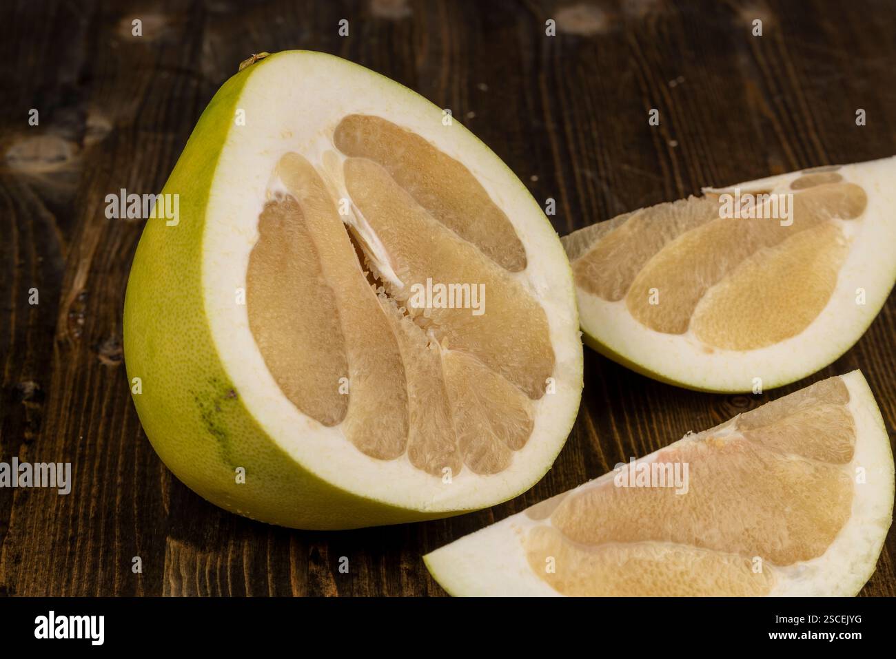 ripe pomelo with lots of pulp cut into pieces Stock Photo - Alamy