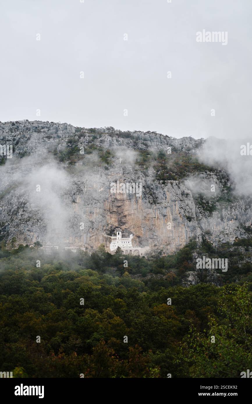Saint Basil monastery carved into the mountain in Ostrog in cloudy ...